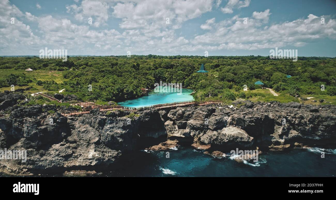 Cliff ocean coast with limpid lake on green top aerial view ...