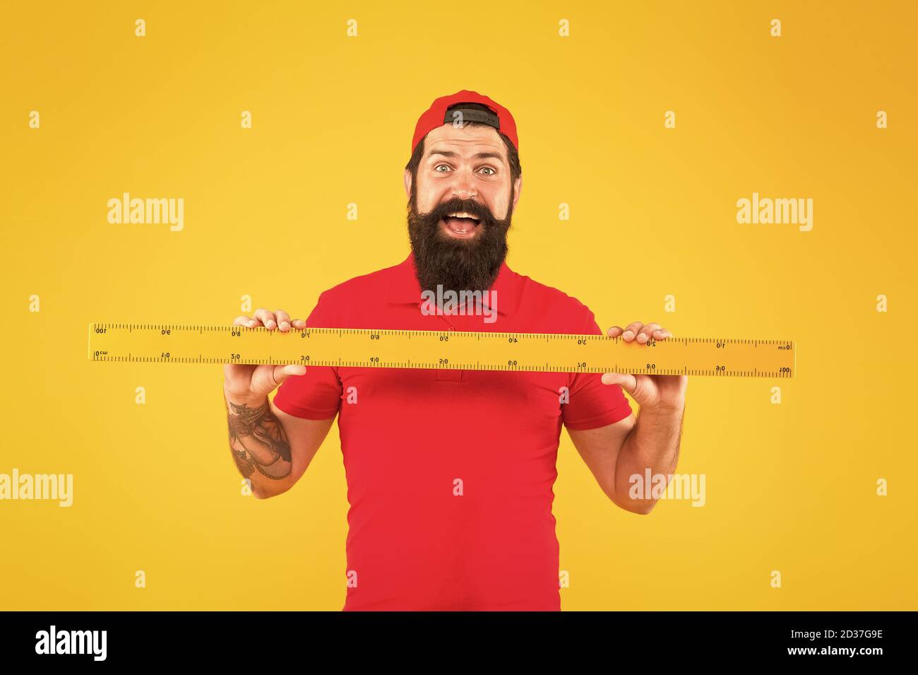 Perfect size. Bearded man with big measuring instrument. Measuring with ...