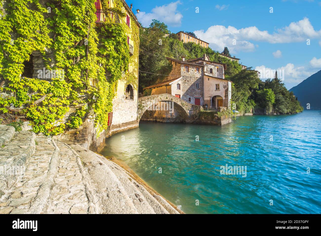 Old stone bridge at the end of Nesso's ravine, Como, Italy Stock Photo ...