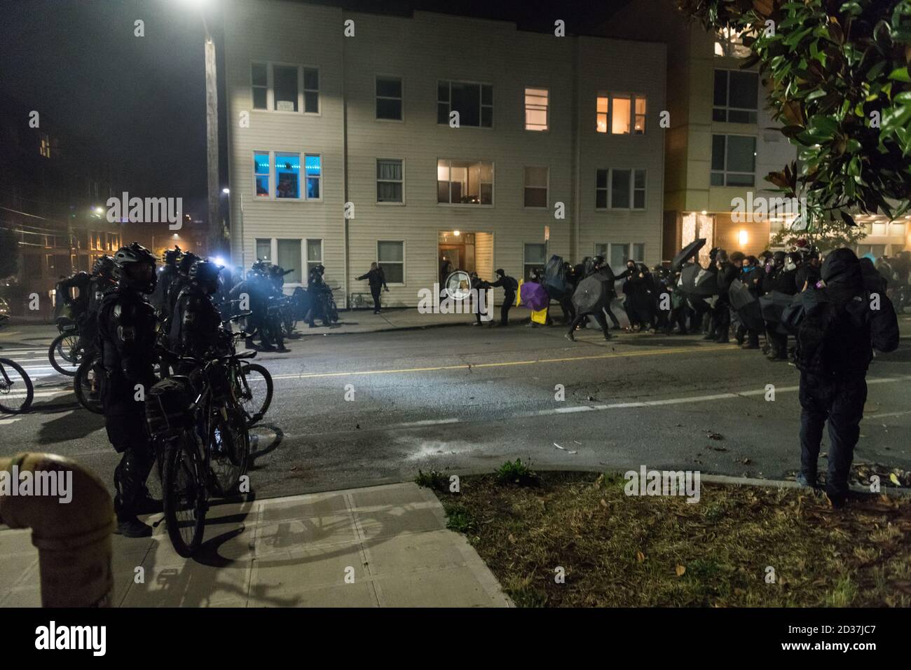 Seattle, USA. 25th Sep, 2020. Late in the evening protestors and Police ...