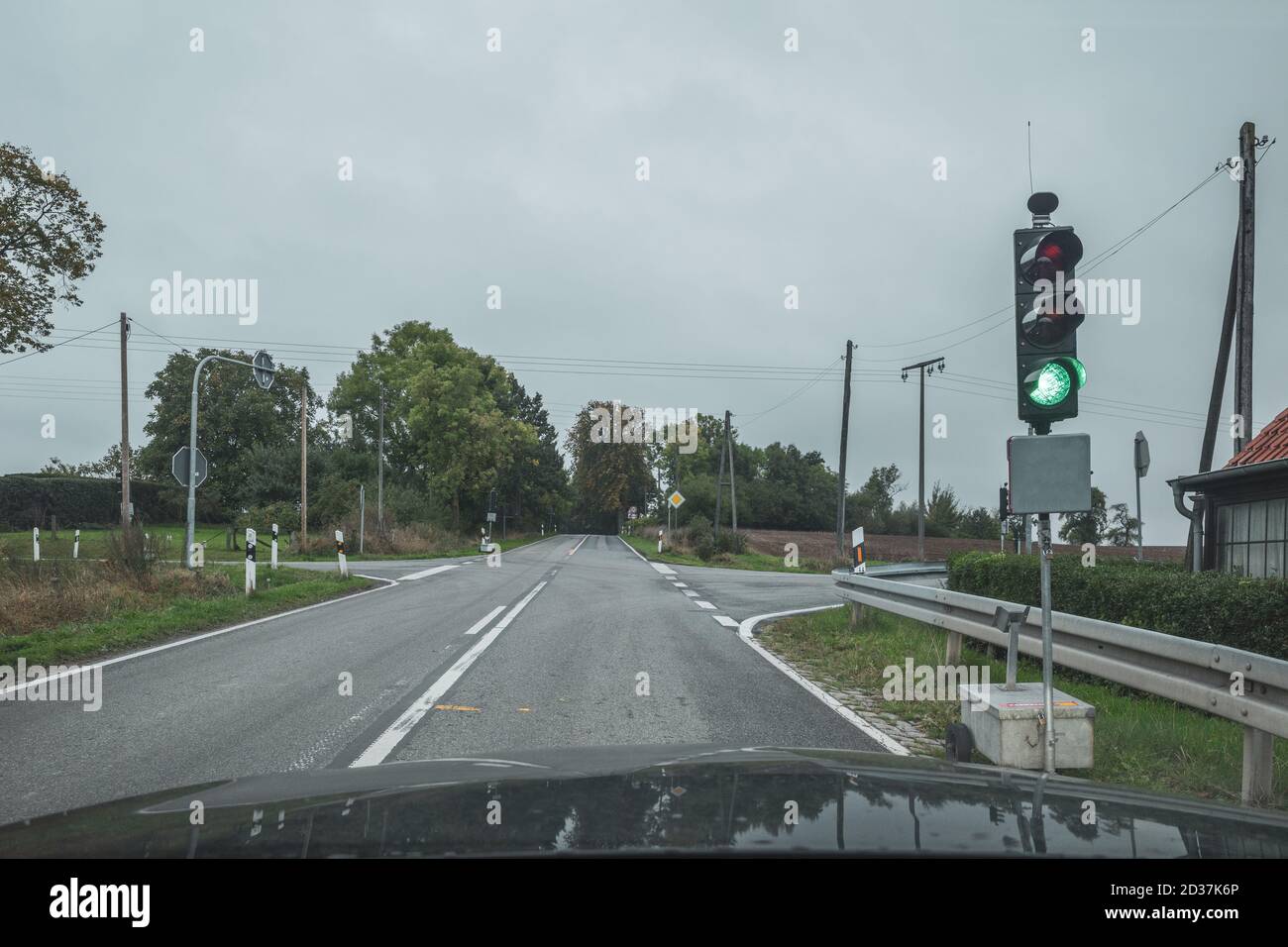 at a road junction there is a mobile traffic light system and the ...