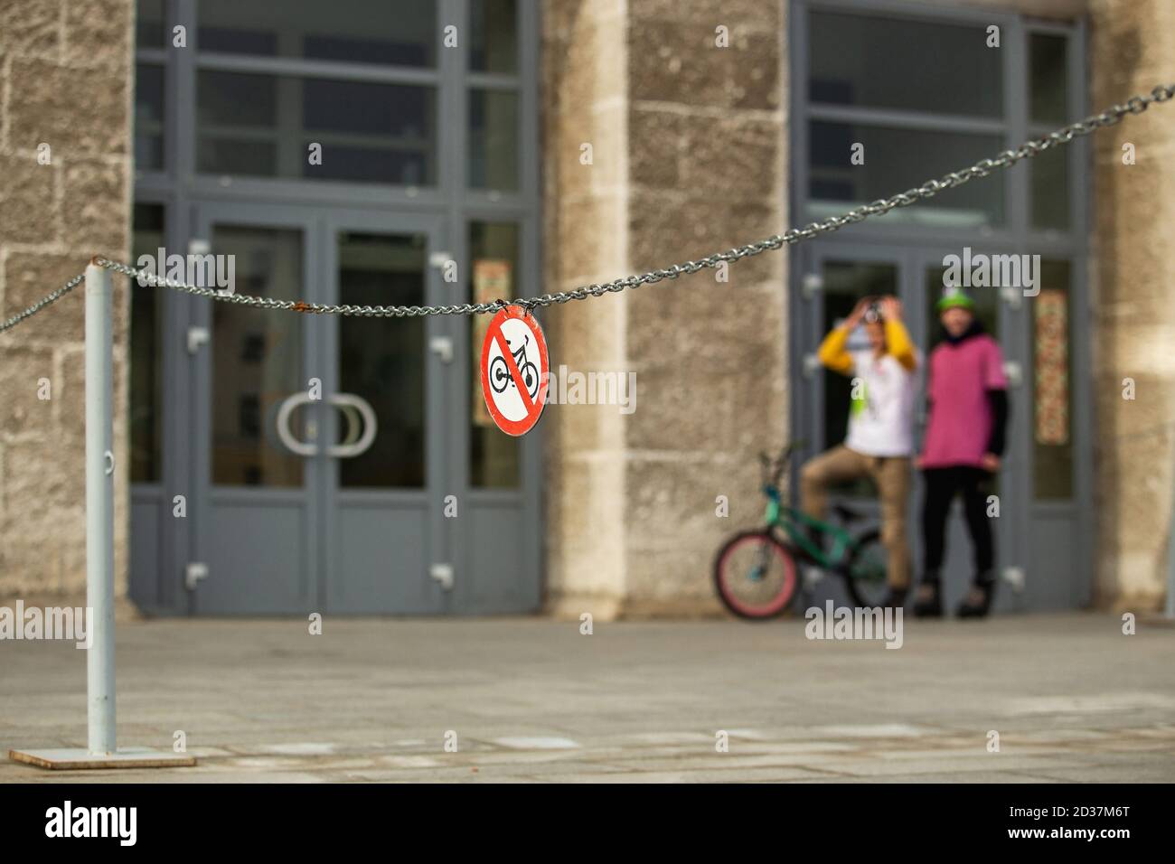 Red bike stop sign on street and urban extreme bmx bikerson the ...