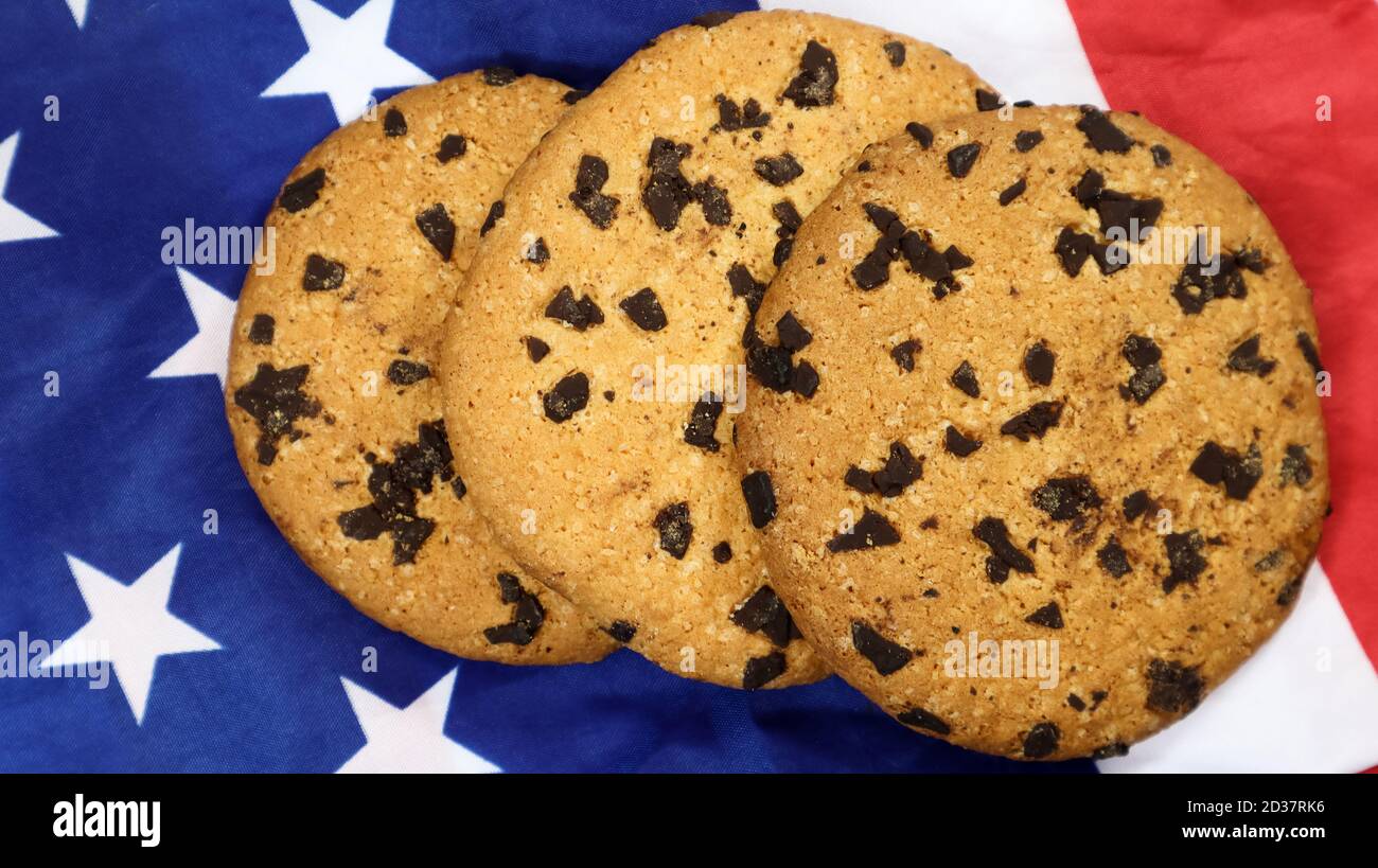 Patriotic cookies. Three rounded traditional chocolate chip cookies on ...