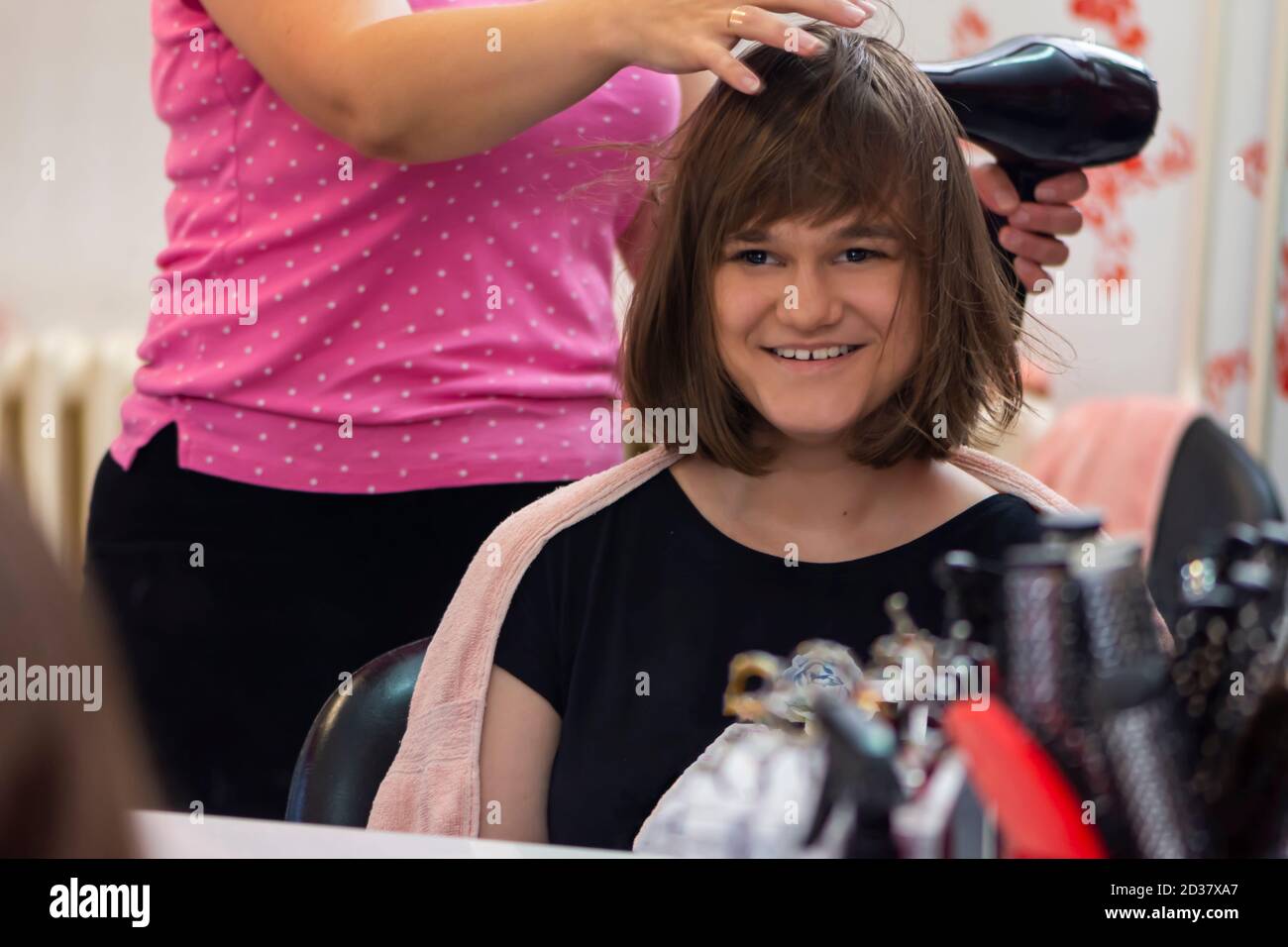Portrait of young girl in hair salon Stock Photo - Alamy