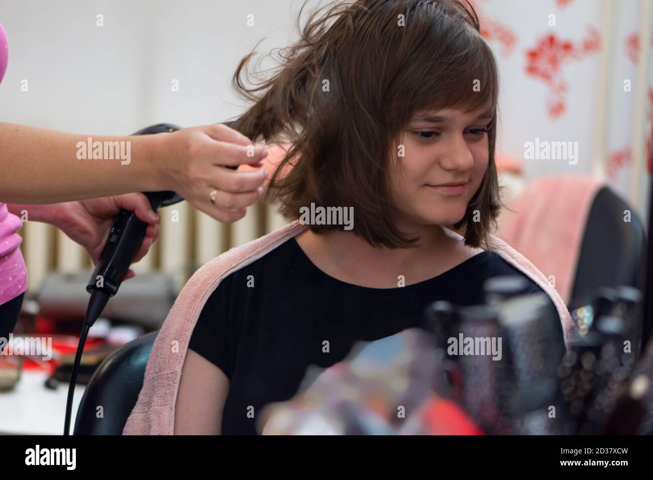 Portrait of young girl in hair salon Stock Photo - Alamy
