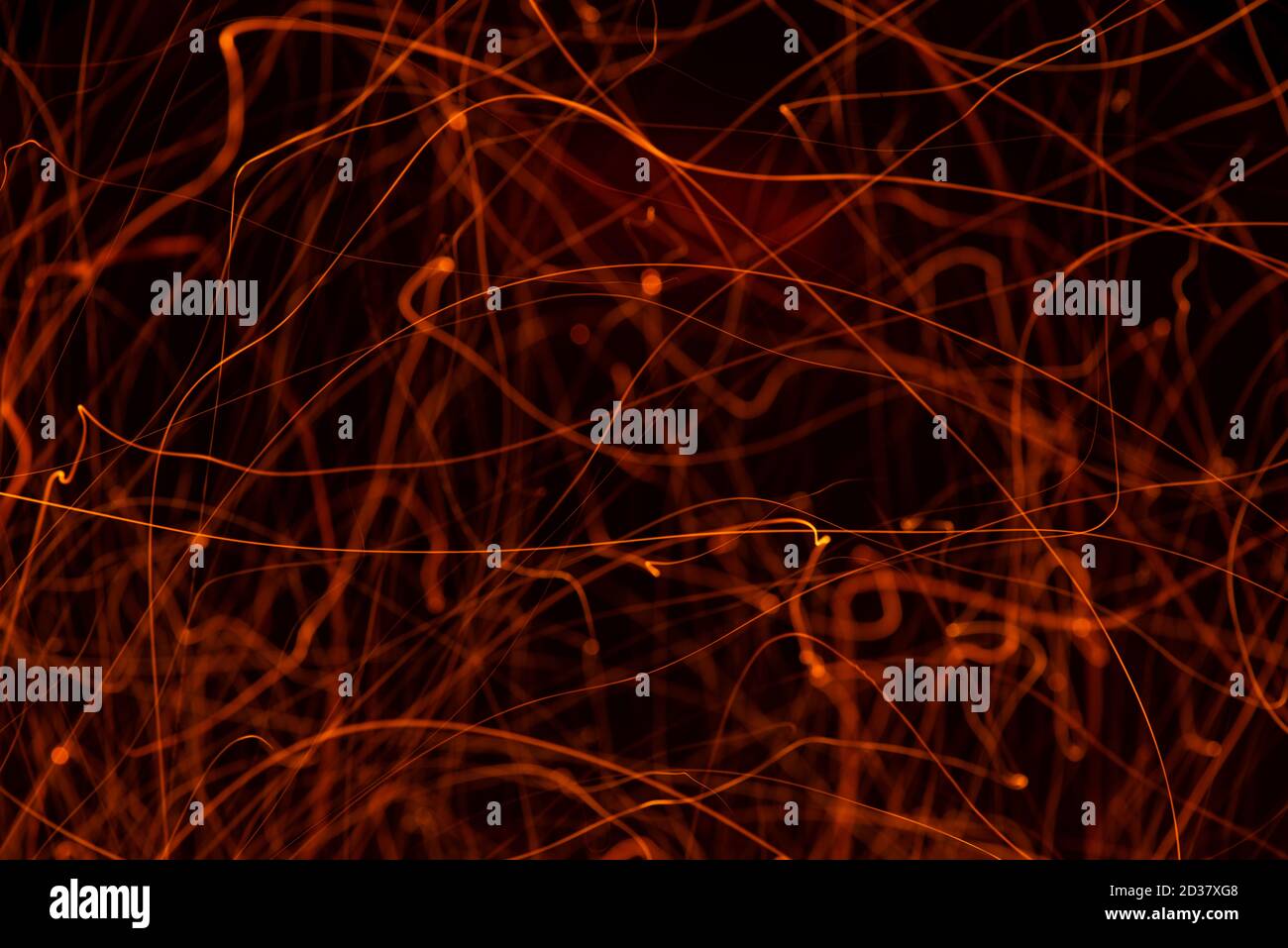 Sparks flying on black background Stock Photo - Alamy