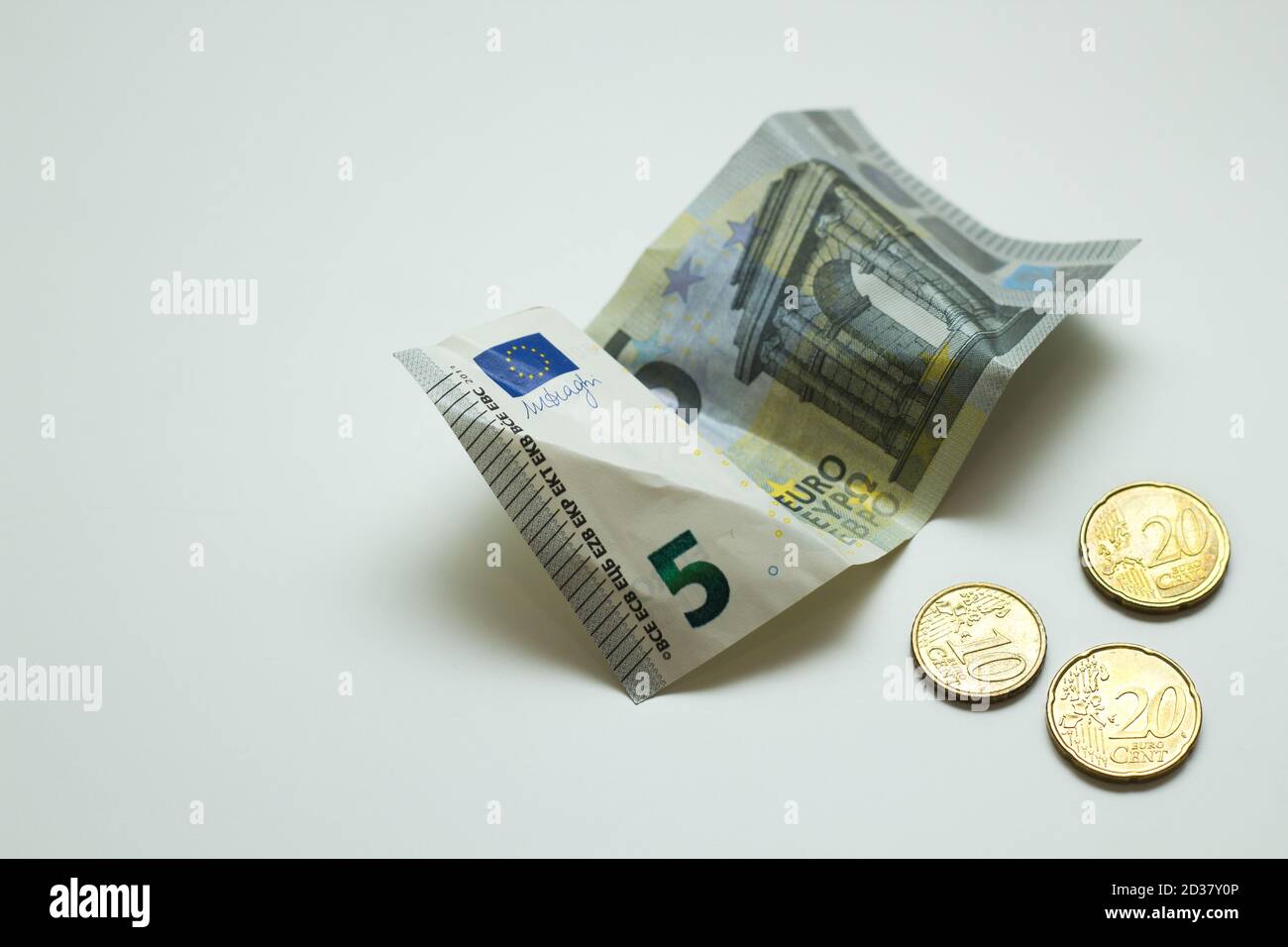 Closeup shot of a pile of euro bills and coins Stock Photo - Alamy