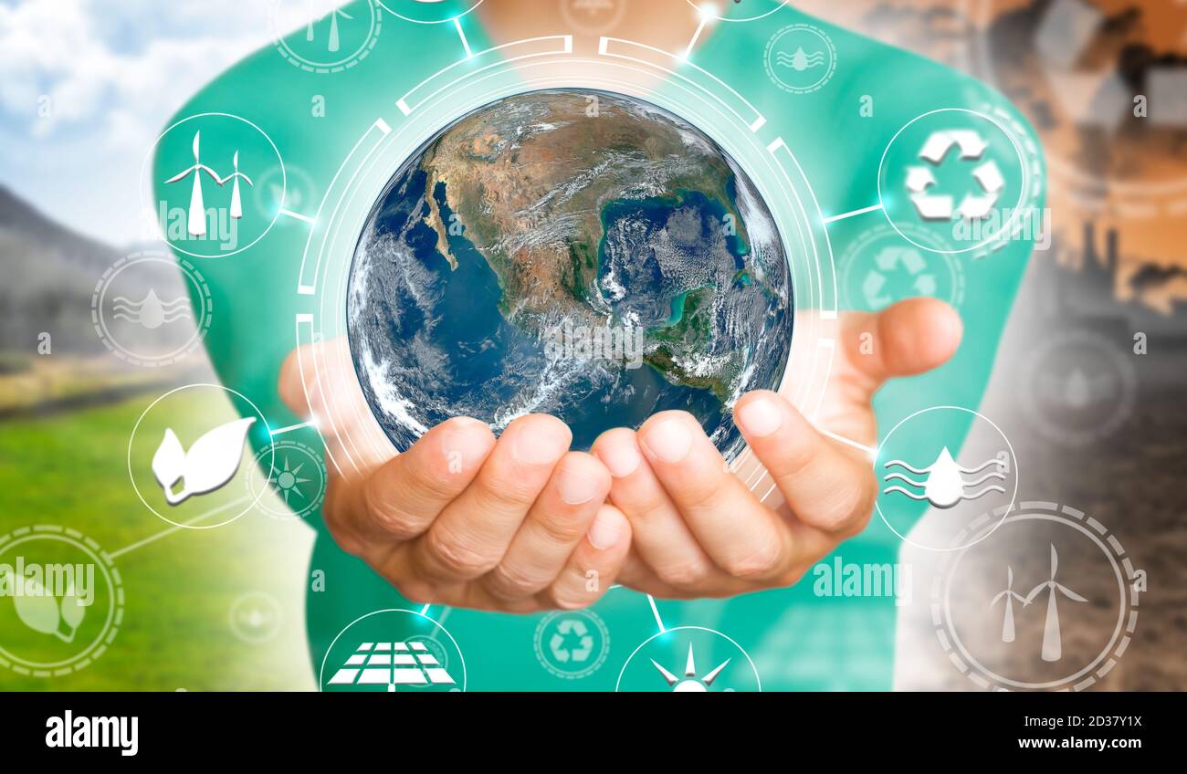 A man's hands holding a miniature Earth. Environmental biodiversity in ...