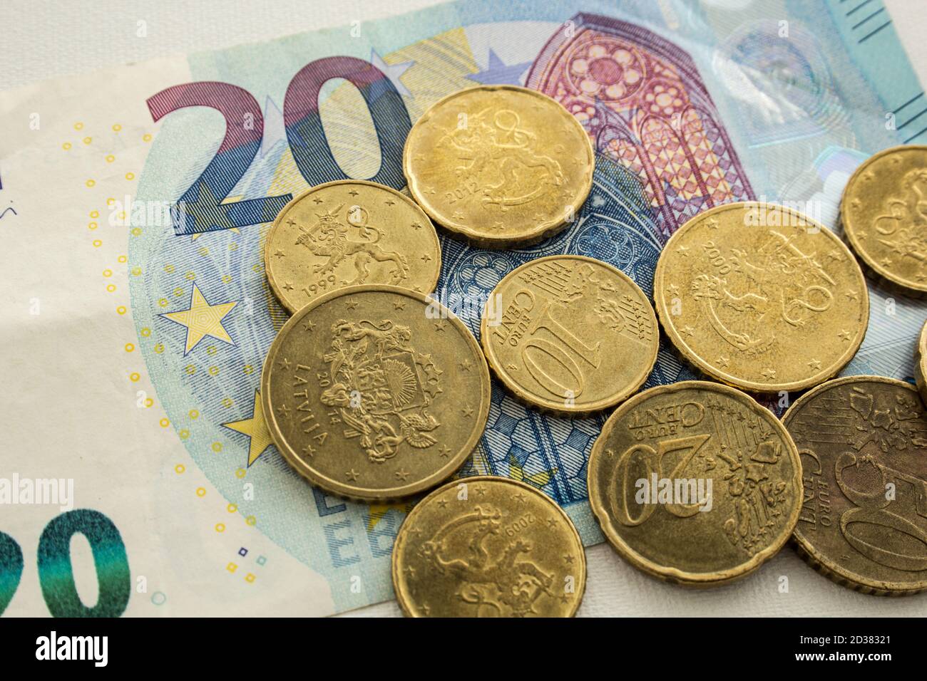 Closeup shot of a pile of euro bills and coins Stock Photo - Alamy