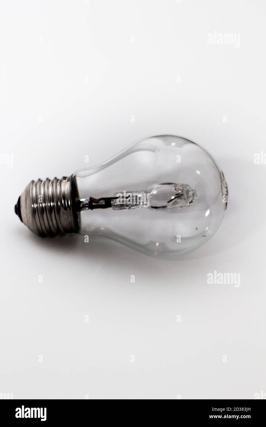 Vertical shot of a light bulb isolated on white background Stock Photo ...