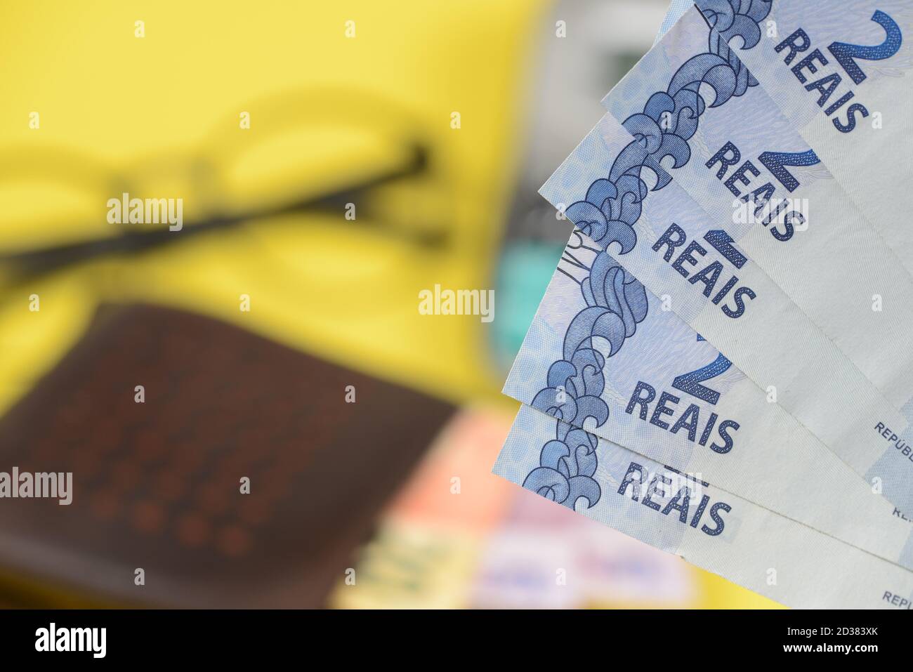 money coming out of wallet with blurred background Stock Photo - Alamy