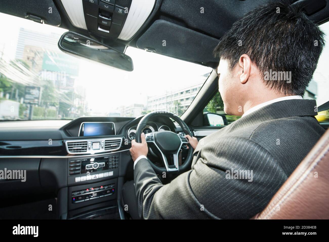chauffeur driving luxury car in Bangkok Stock Photo - Alamy