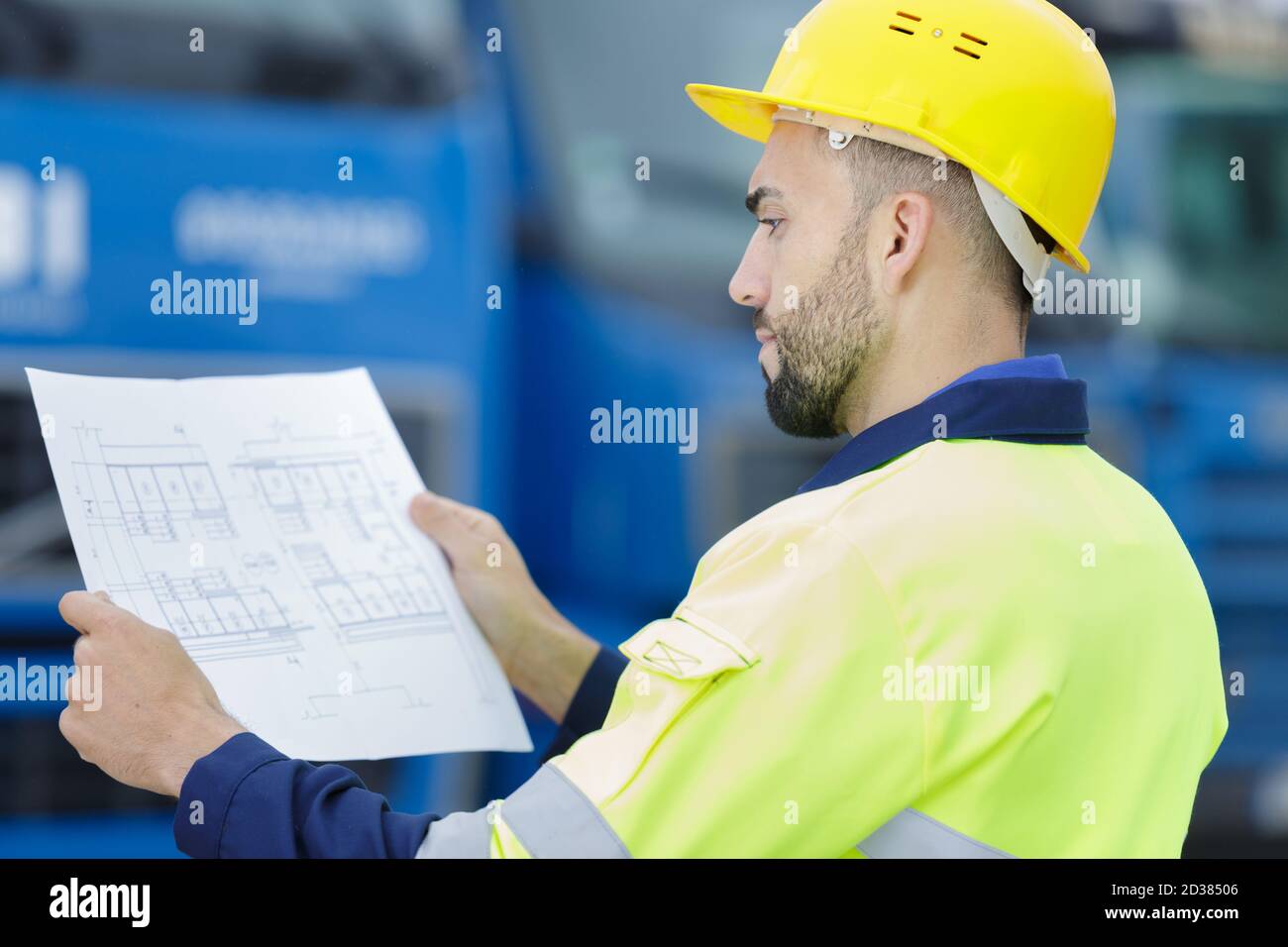 worker reading in shipping yard Stock Photo - Alamy