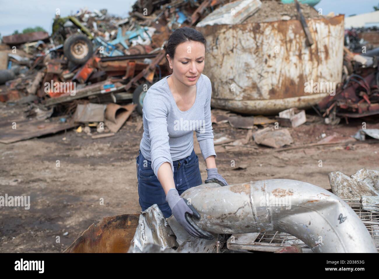 woman working at a junkyard Stock Photo - Alamy