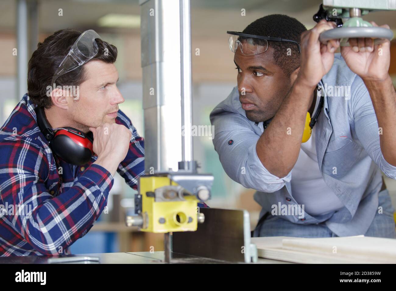 construction workers having a serious conversation Stock Photo - Alamy
