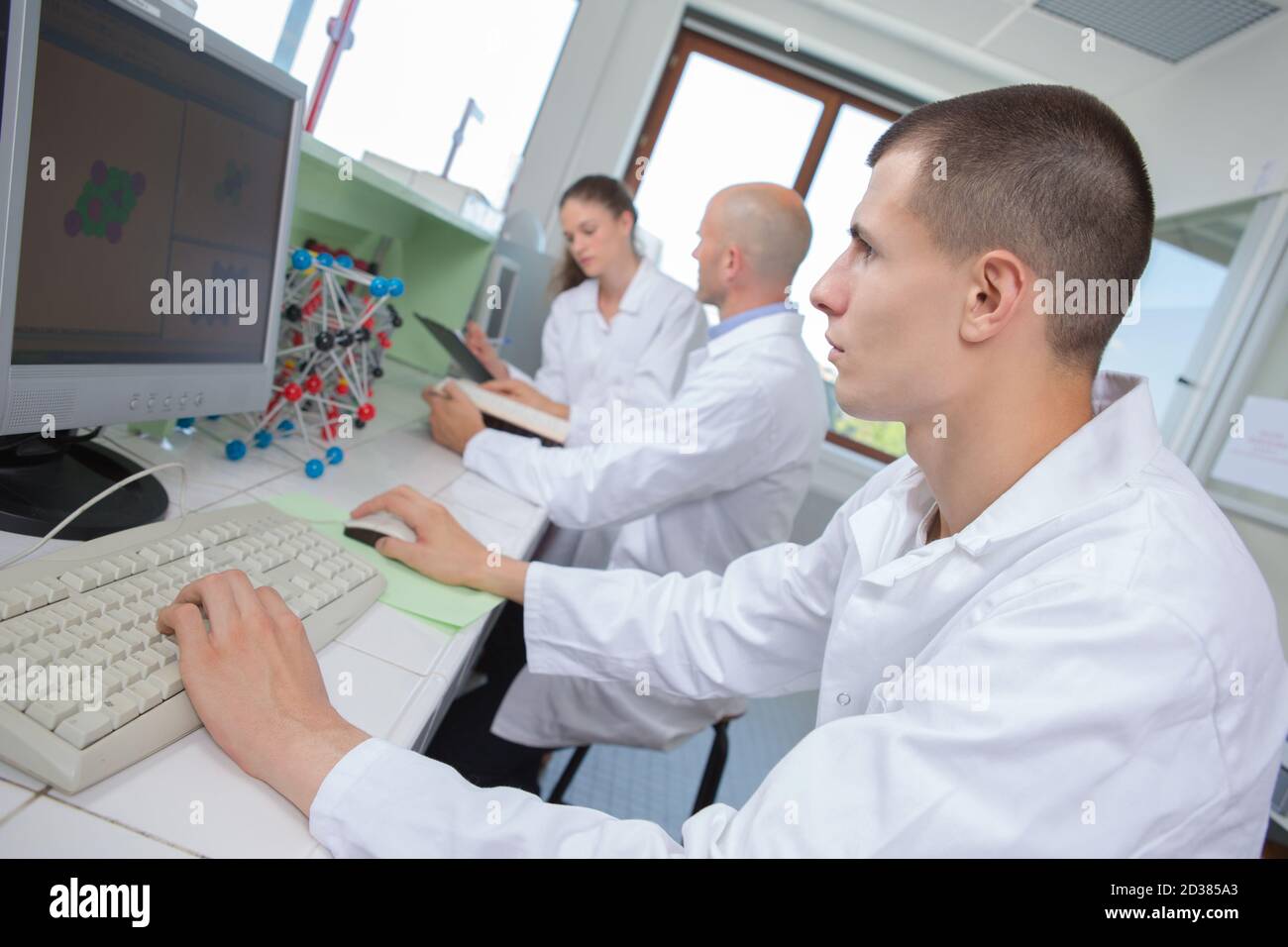 young scientist using a computer Stock Photo - Alamy