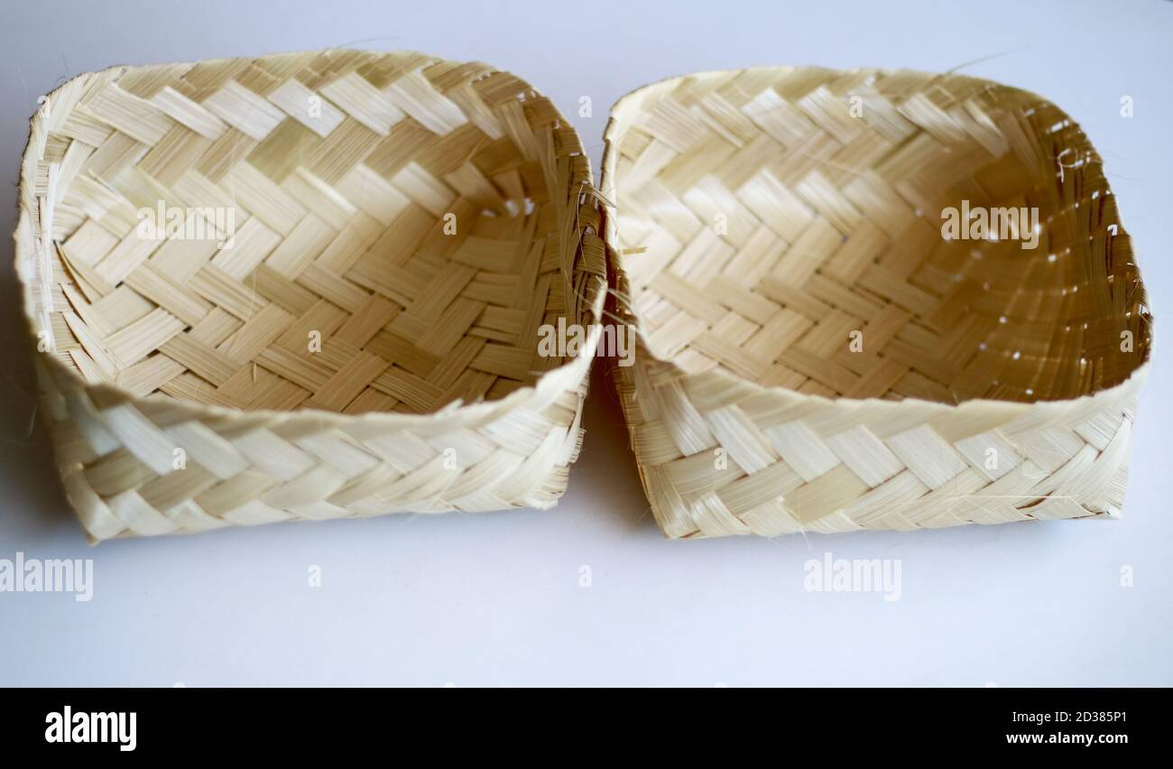 Besek (containers made of plaited bamboo) on white background Stock ...