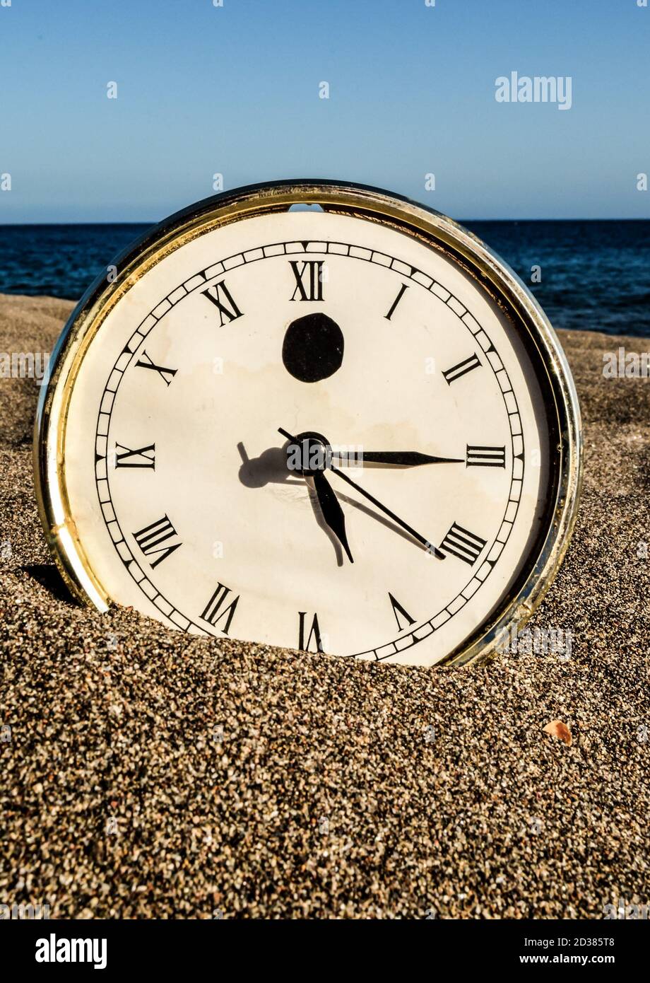 Clock on the Sand Beach Stock Photo - Alamy