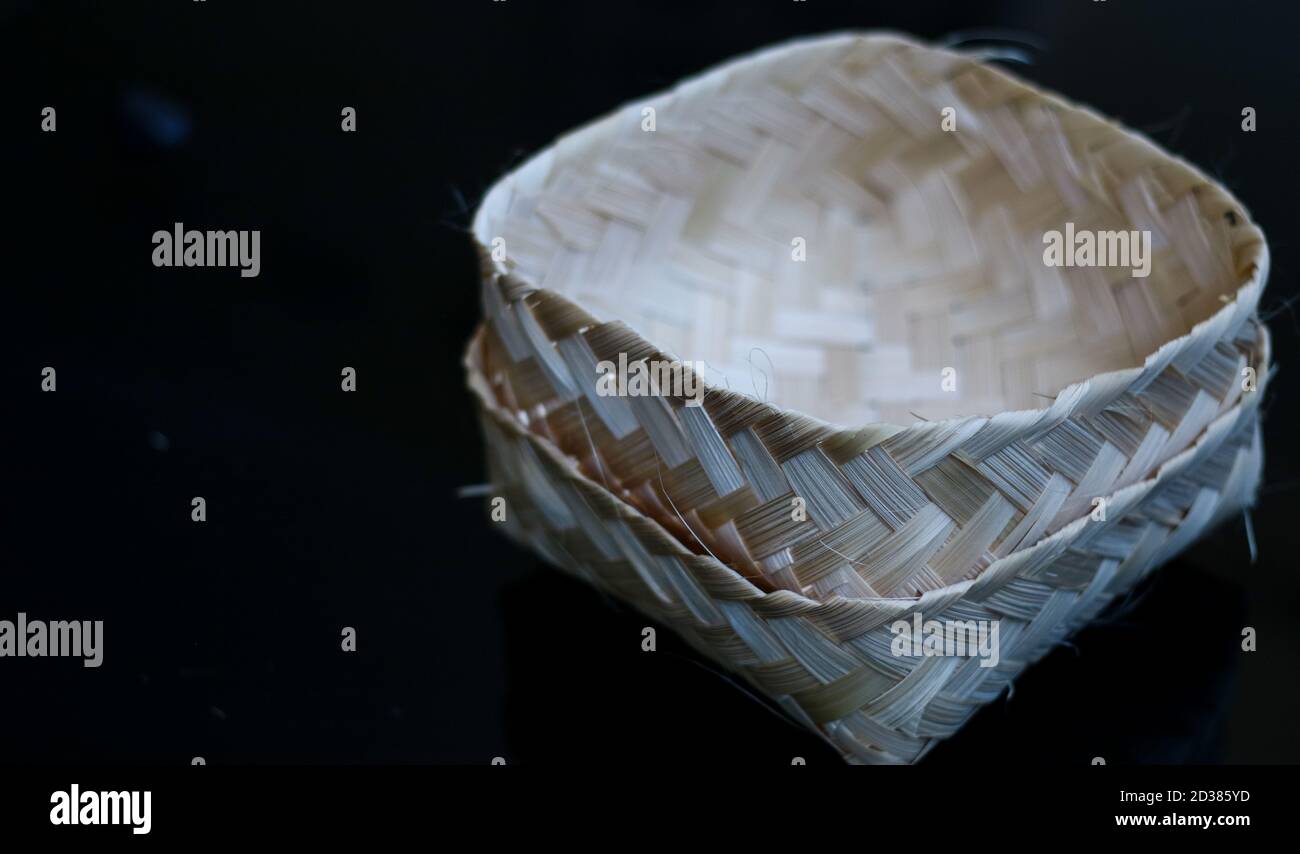 Besek (containers made of plaited bamboo) on black background Stock ...