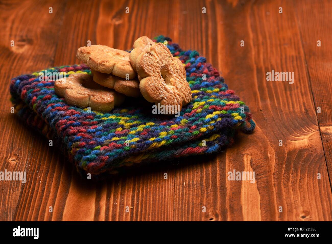 Tea cookies on wooden background. Flower shaped biscuits lying on ...