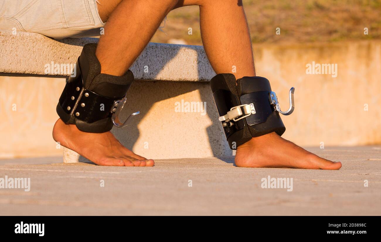 Man in anti gravity or inversion boots ready for upside down hanging on ...