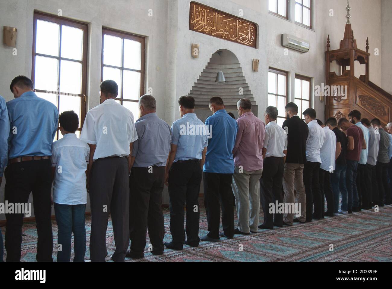 Group of muslims standing at prayer in beautiful decorated mosque Stock ...