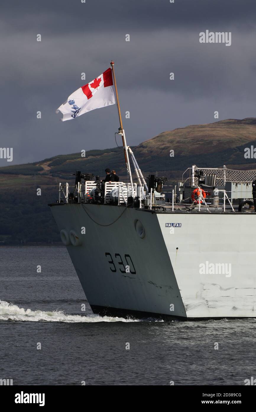 The Ensign of the Royal Canadian Navy, being flown from HMCS Halifax ...