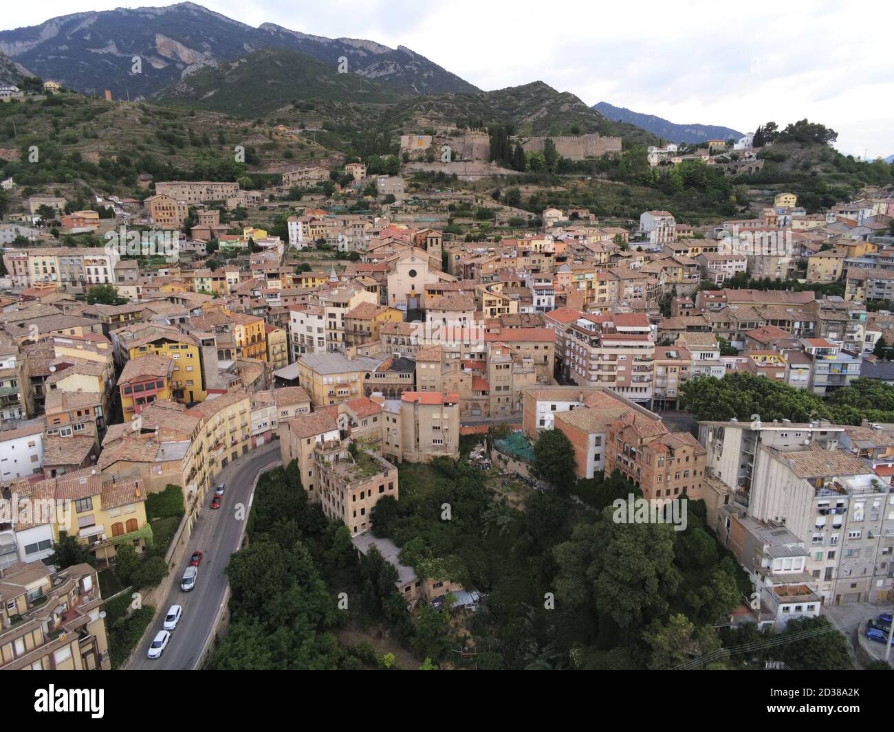 Landscape of Berga surrounded by hills under a cloudy sky in Barcelona ...