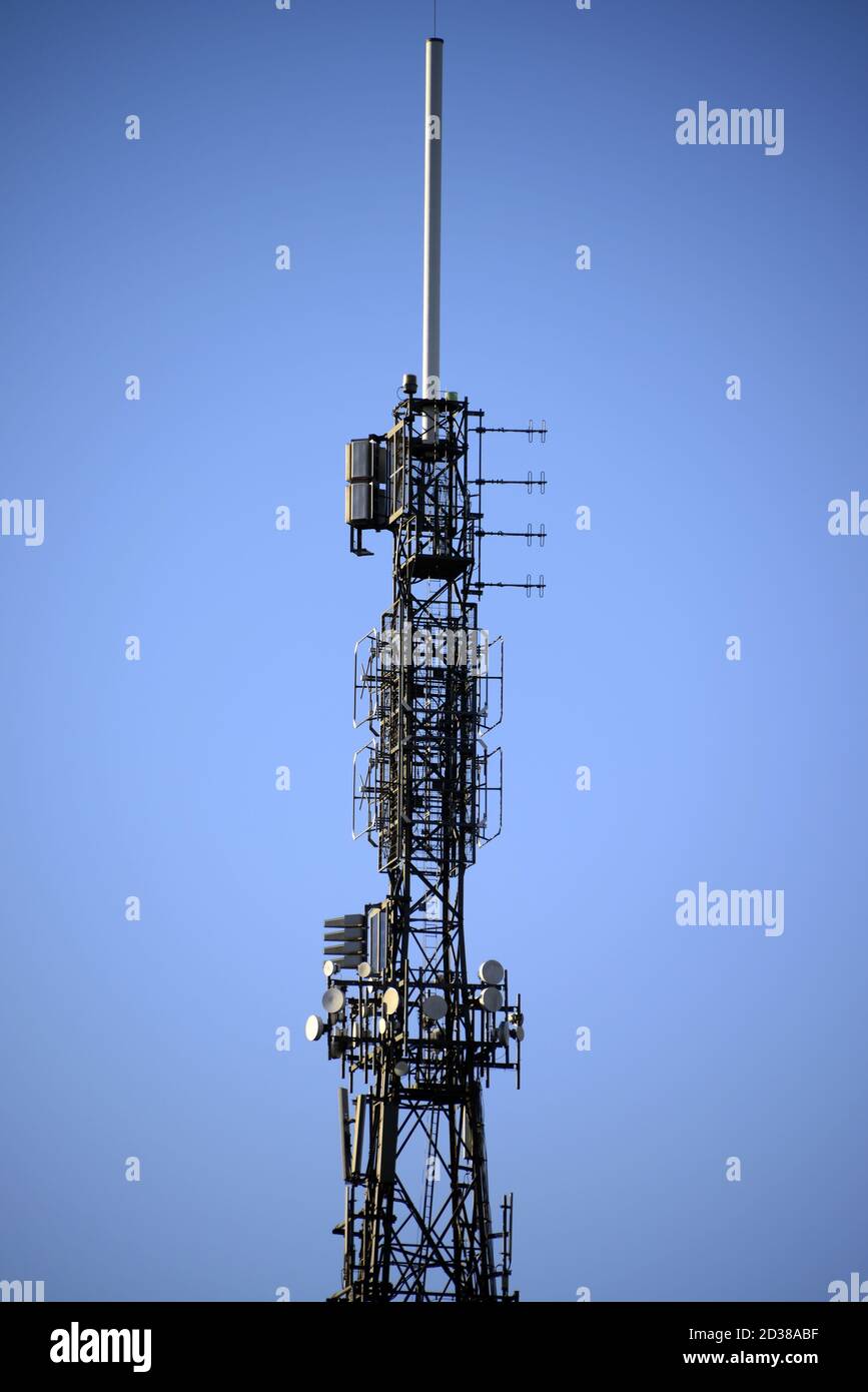 Telecommunications mast with antennas and dishes Stock Photo - Alamy