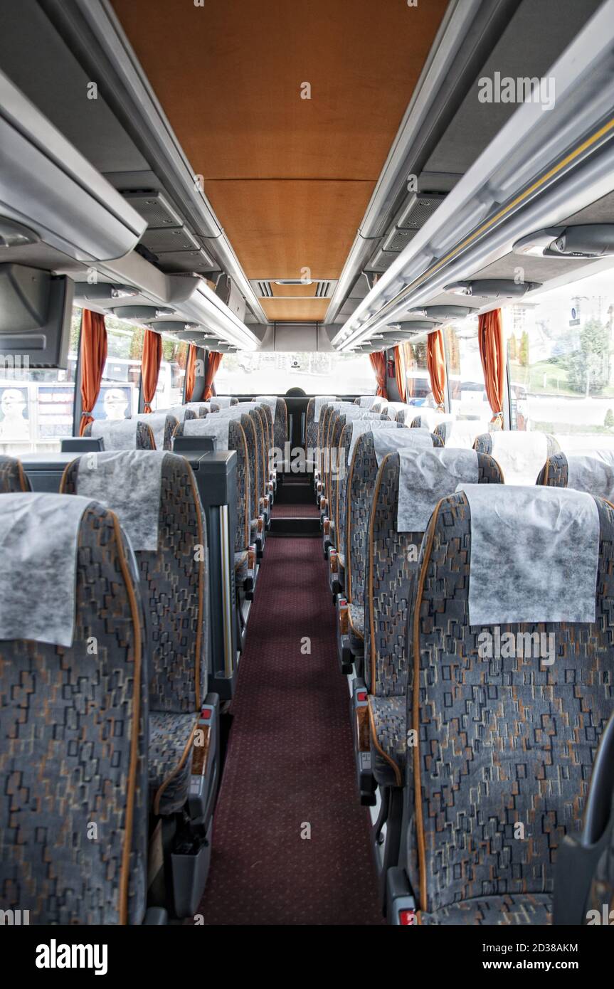Vertical shot of a bright orange bus interior Stock Photo - Alamy
