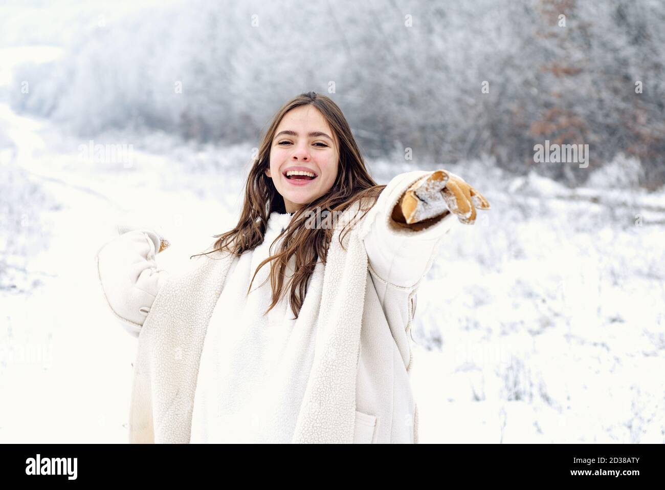 Snowball game. Playing with snow and having fun in winter park ...