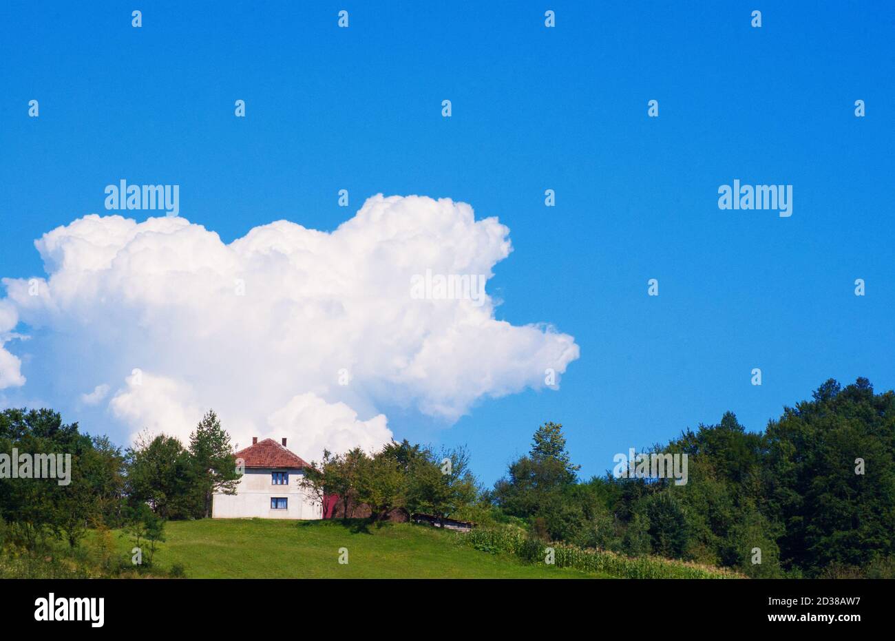 family home clouds background Stock Photo - Alamy