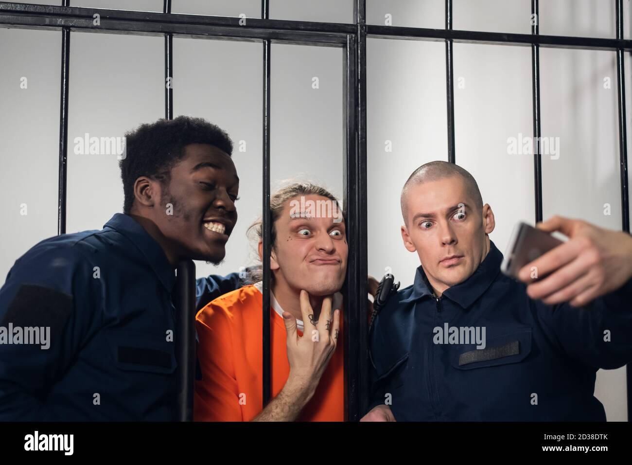Theme party on the theme of prison. The guys take a fun selfie with ...