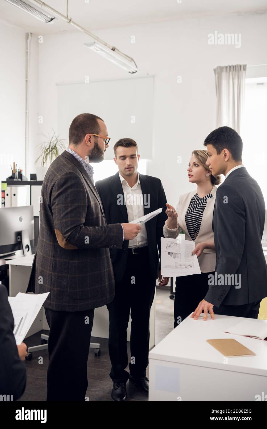 Planning session for young businessmen in the co-working office ...