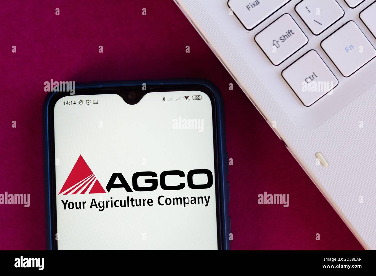 In this photo illustration the AGCO Corporation logo seen displayed on ...