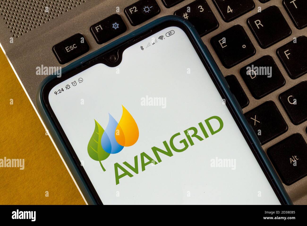 In this photo illustration the Avangrid logo seen displayed on a ...