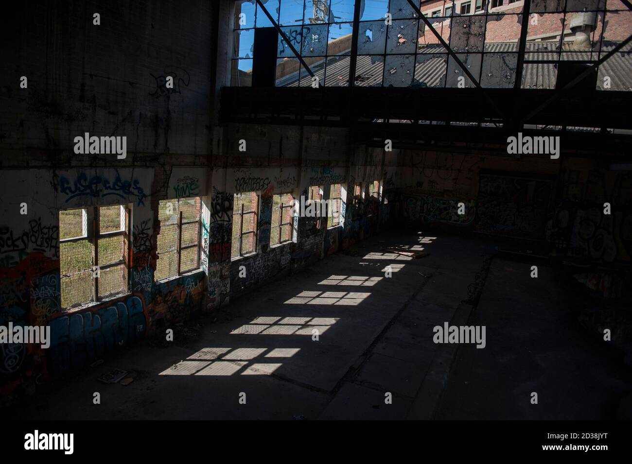Sun falling through the broken windows of the abandoned Bradmill Cotton ...