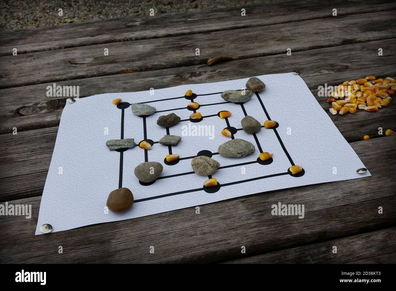 Playing with pebbles and grains Stock Photo - Alamy