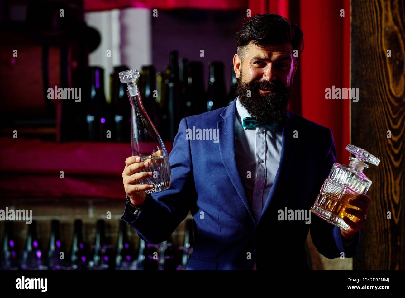 Handsome bearded barman with long beard and mustache with serious face ...