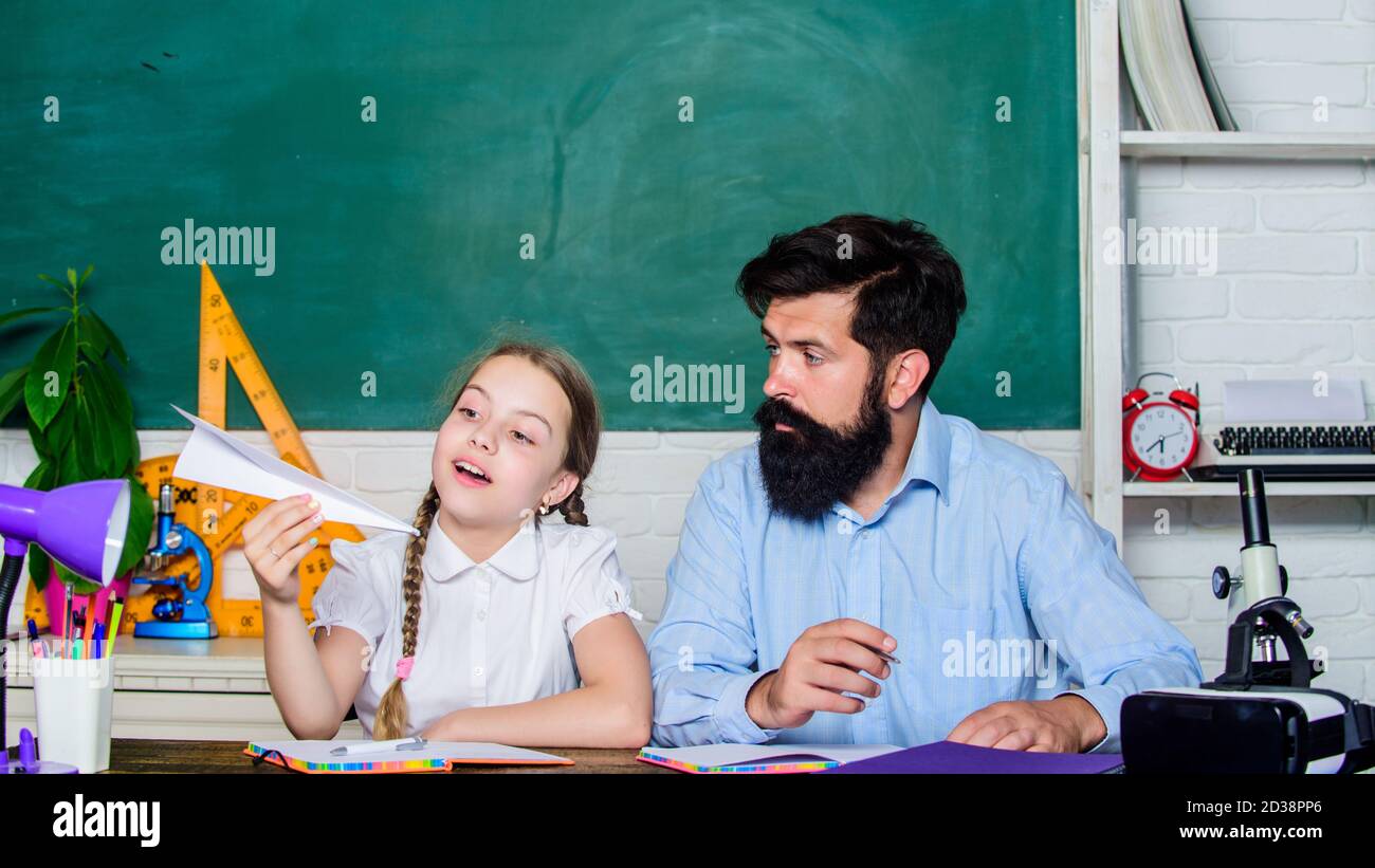 Creating a community of learners. Teacher and schoolgirl. Man bearded ...