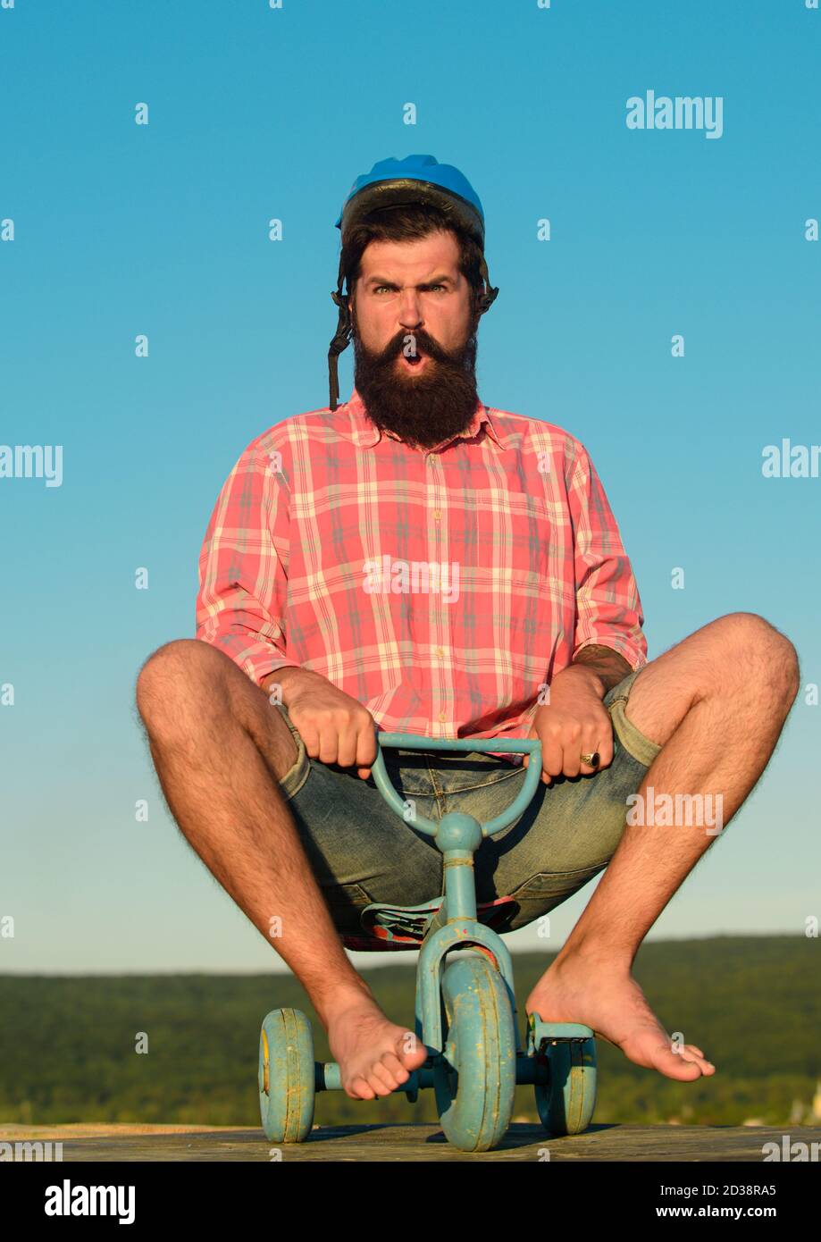 Crazy Young Man Riding A Small Bike High Resolution Stock Photography ...