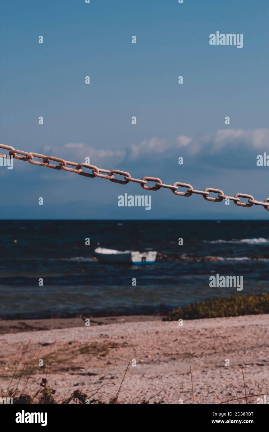 Chain in sand on beach hi-res stock photography and images - Alamy
