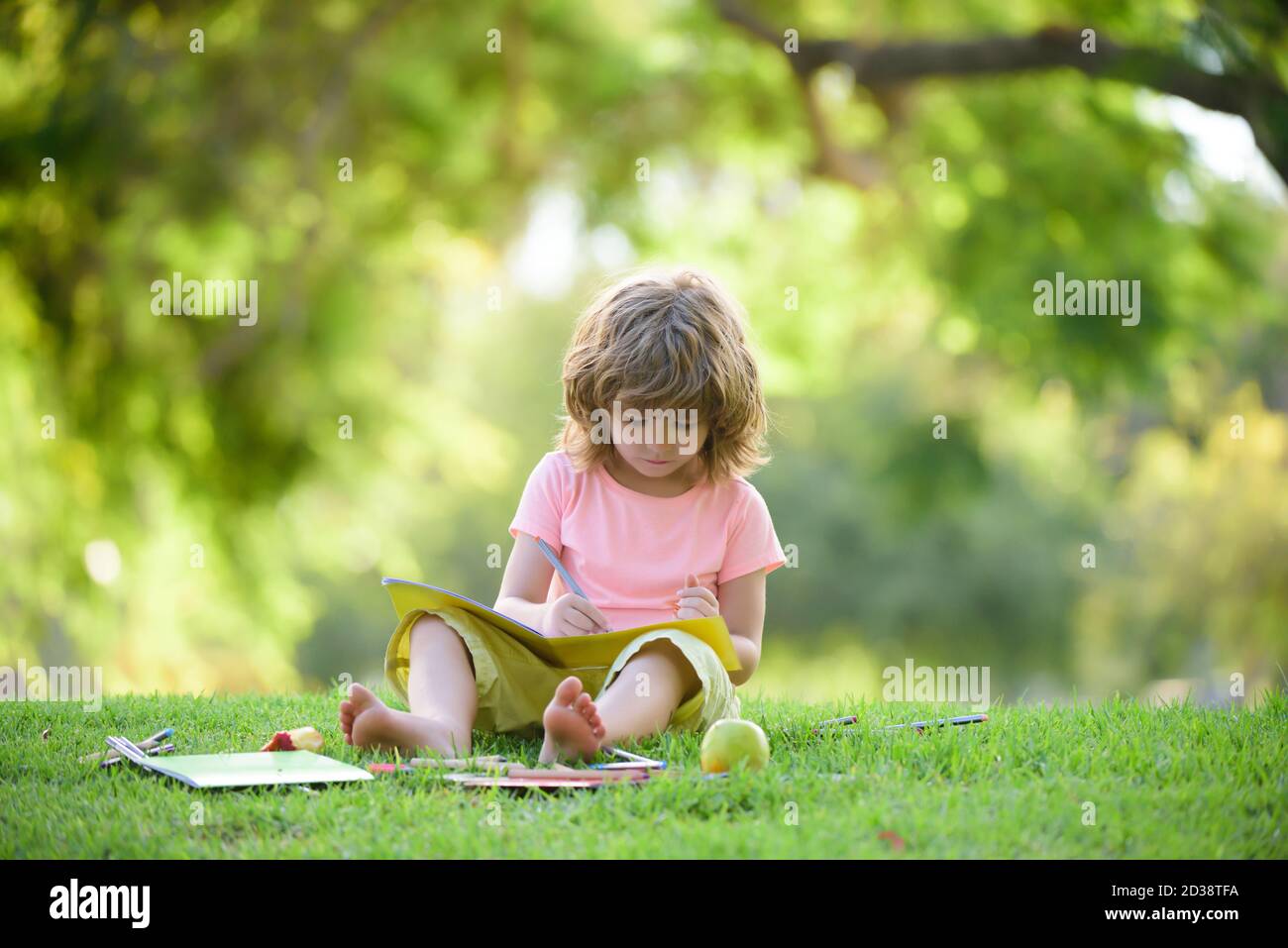 Home children learning. Cute pupil in elementary school Stock Photo - Alamy