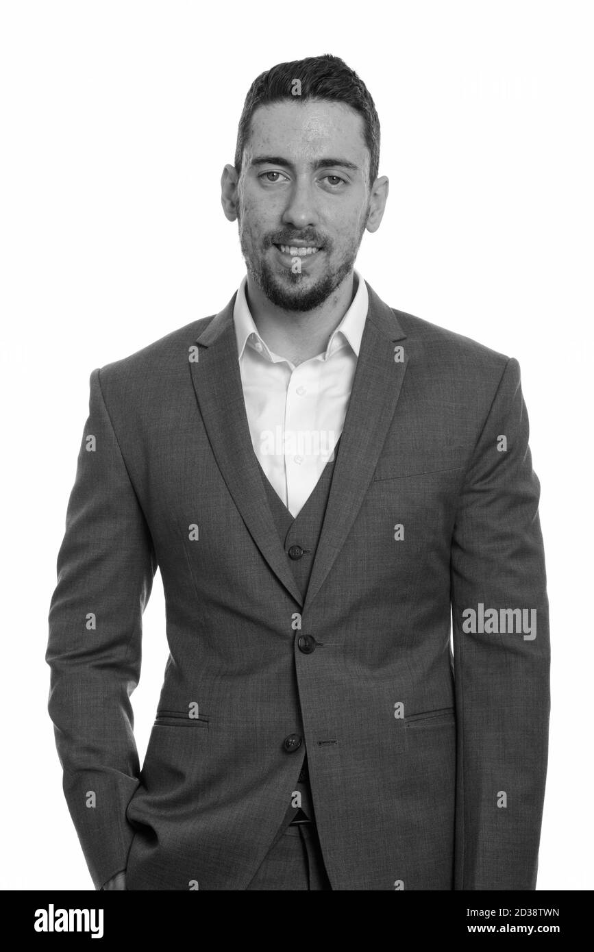 Portrait of happy young handsome bearded businessman in suit smiling Stock Photo - Alamy