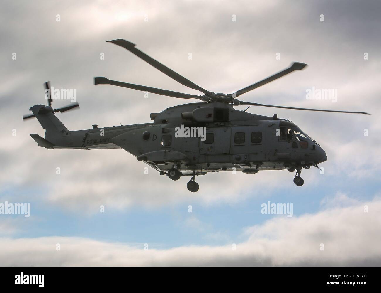 A Royal Navy Merlin Helicopter flies above Her Majesty's Ship (HMS ...
