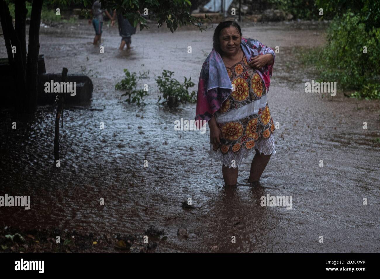 Merida, Mexico. 07th Oct, 2020. A woman walks ankle-deep in water ...