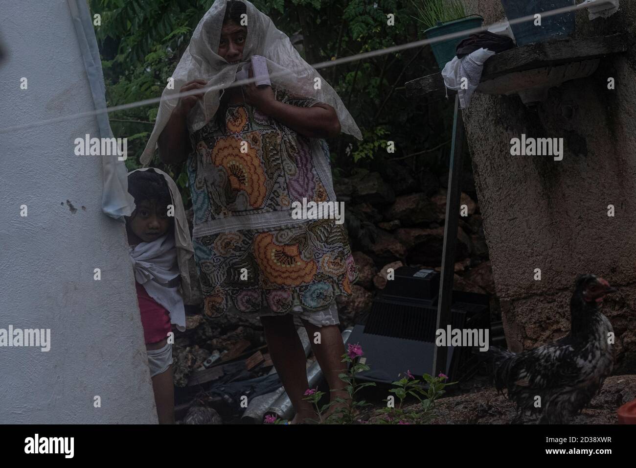 Merida, Mexico. 07th Oct, 2020. A woman and a child have each pulled a ...