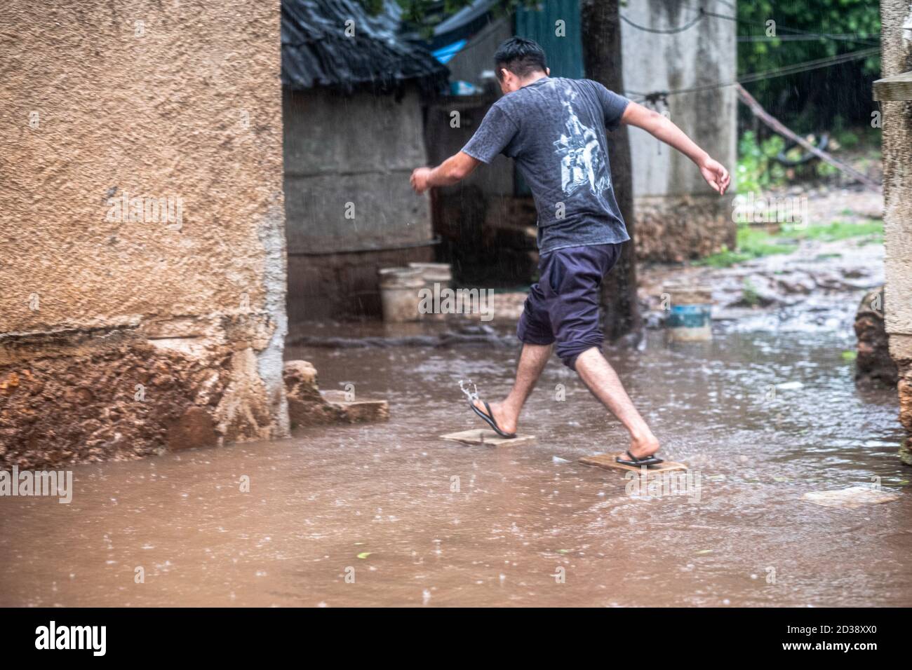 Merida, Mexico. 07th Oct, 2020. A man walks over stones that have been ...
