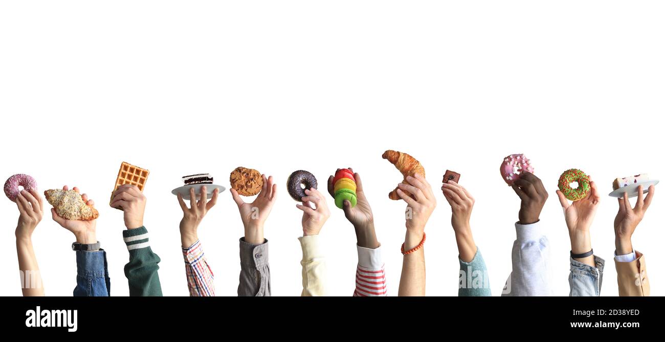 People are holding different desserts in their hands. The concept of ...