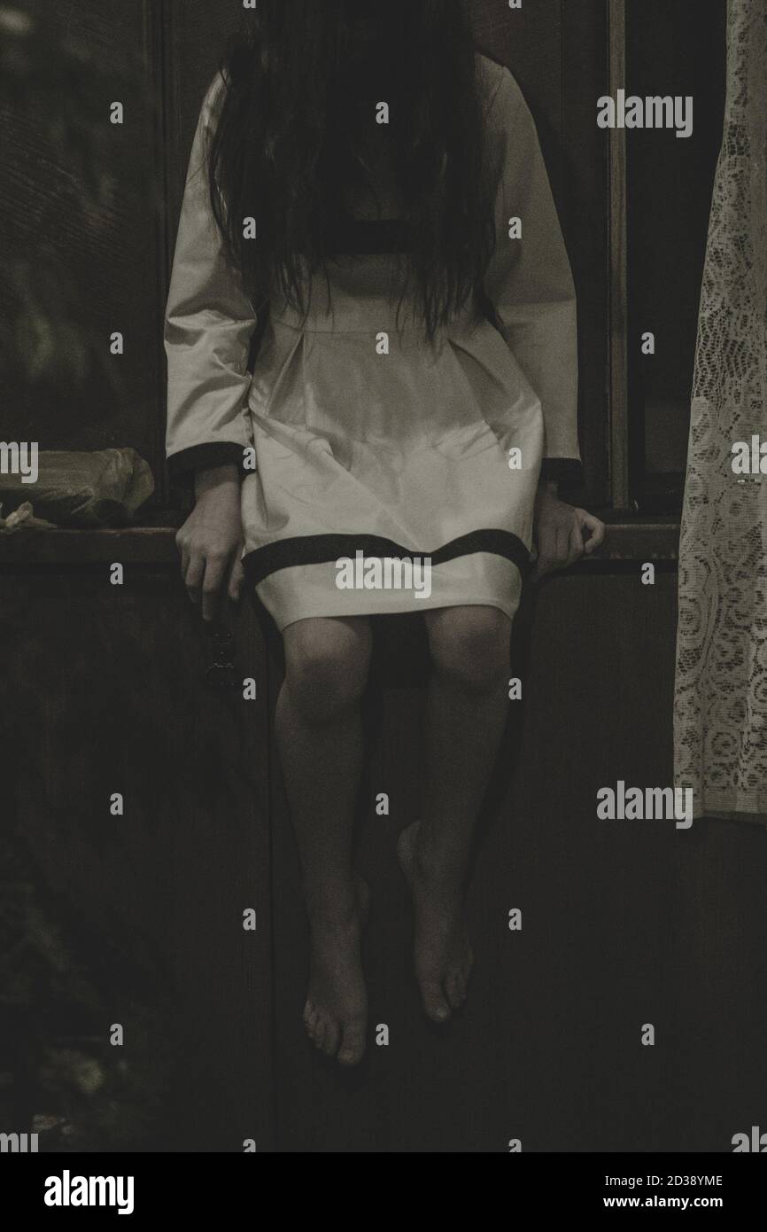 Demon possessed little girl at night. Mad scary girl at dark night ...